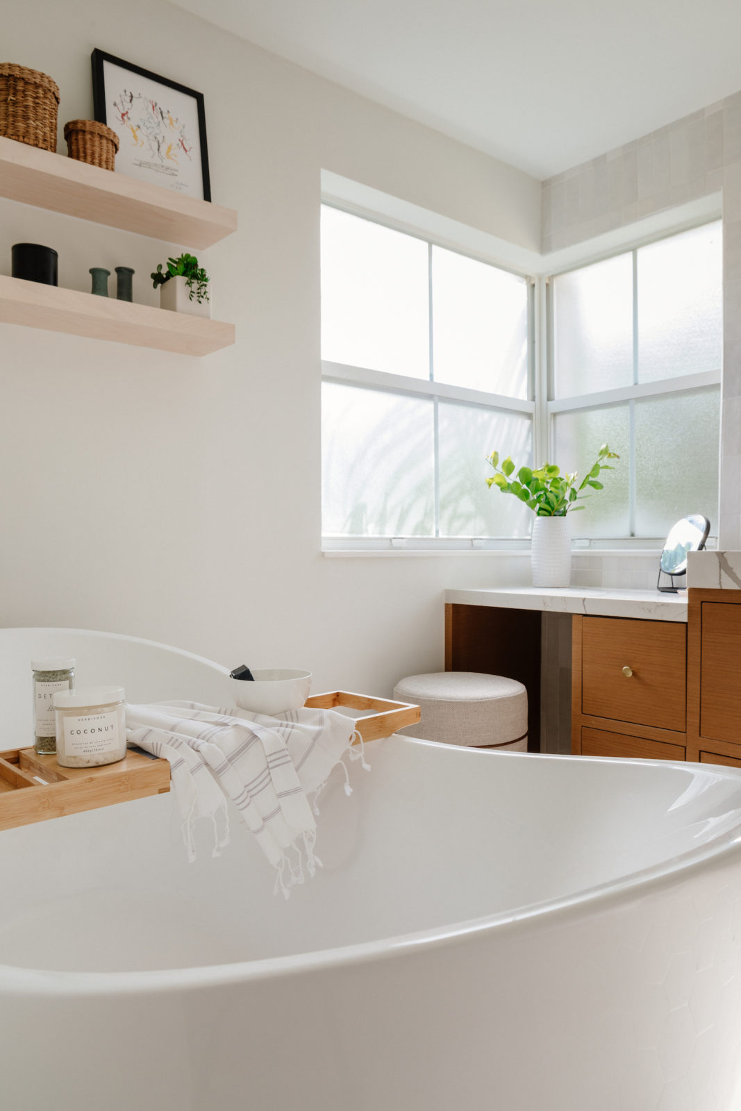 Warm White Tiles and Earthy Teak Give This Bathroom a Spa-like Feel · Haven