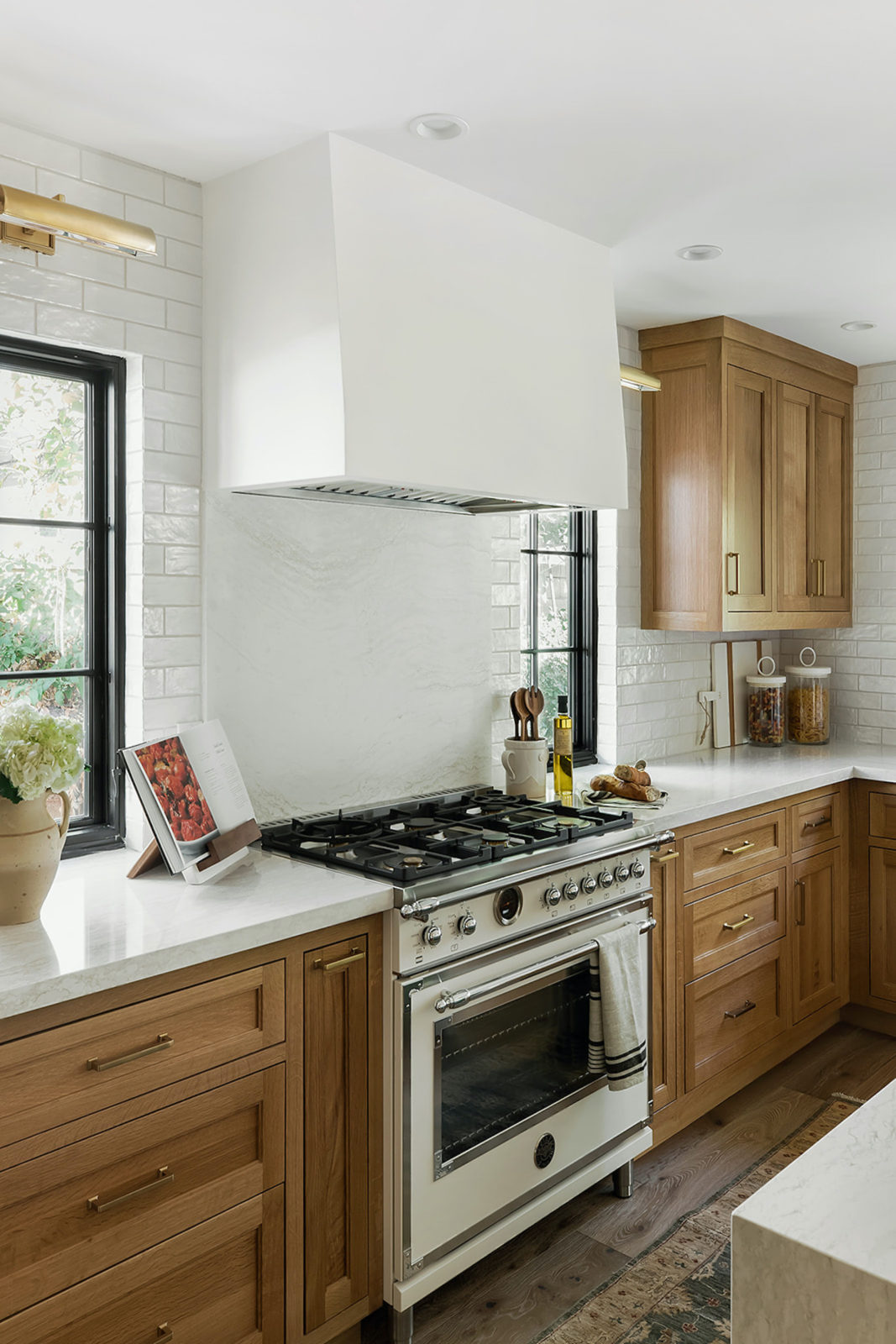 Glass Pantry Doors and Angled Waterfall Counters Spice up This Kitchen ...